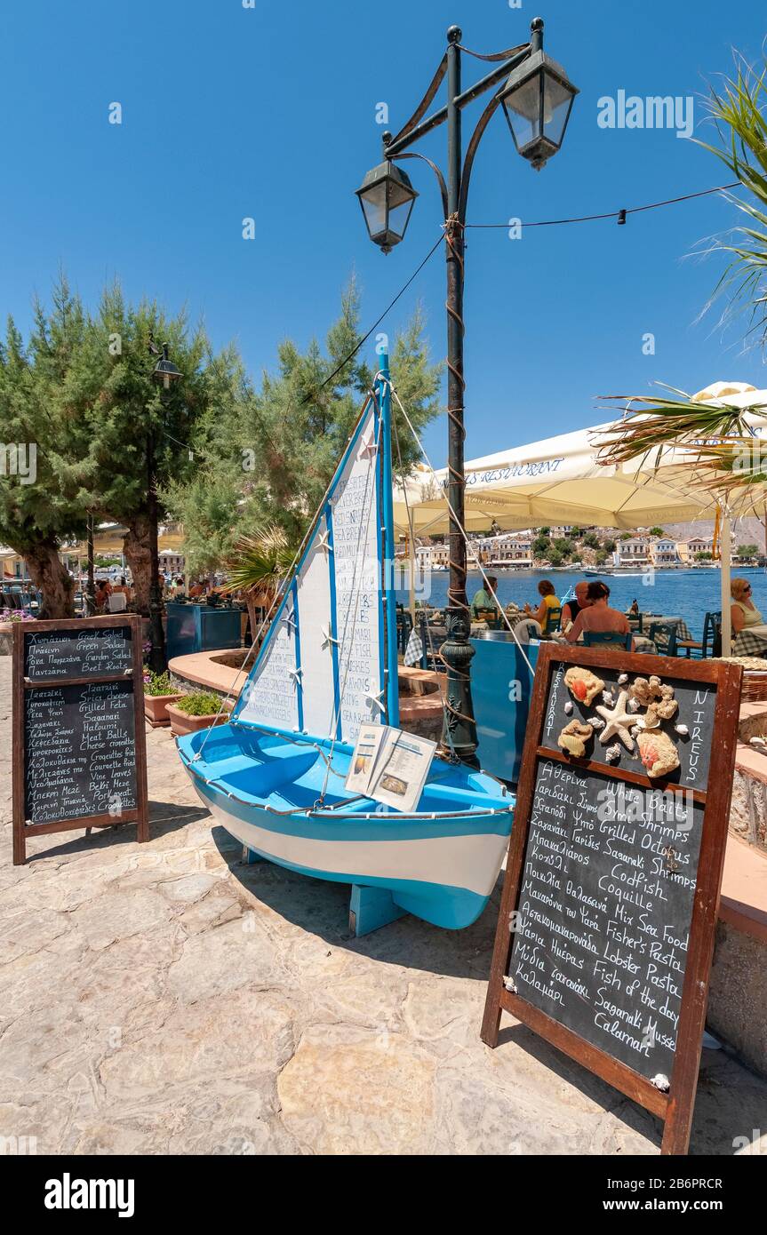 Harbourside restaurant Symi Town Symi Greek Islands Greece Stock Photo ...