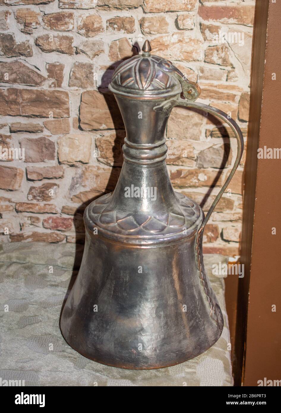 Very old style metal ewer water jar in view Stock Photo - Alamy