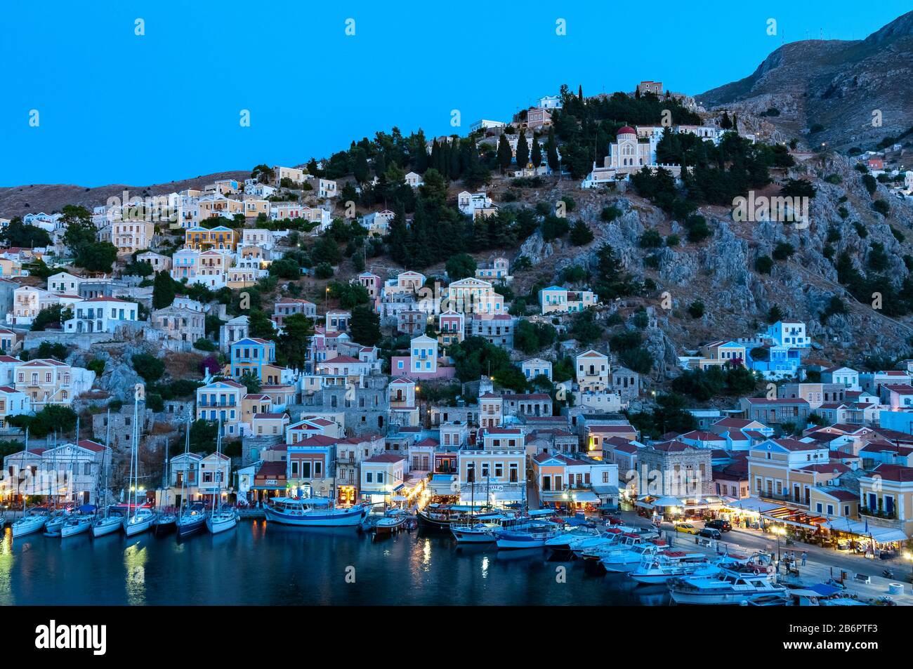 View over harbour at dusk Symi Town Symi Greek Islands Greece Stock ...