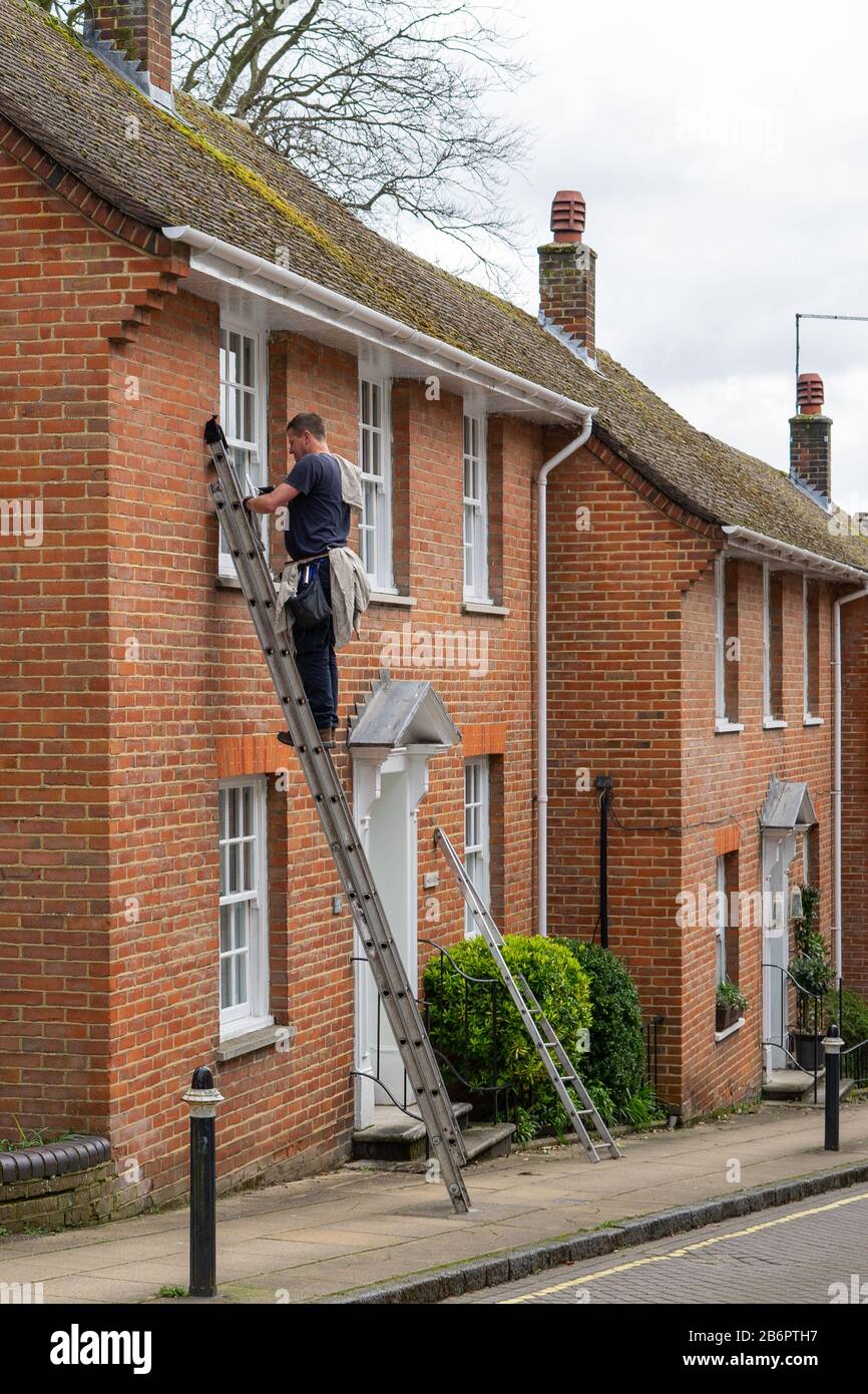 Working up a ladder hi-res stock photography and images - Alamy