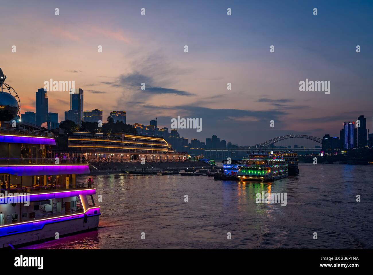Chongqing, China - August 2019 : Brightly lit passengers ships cruise ...