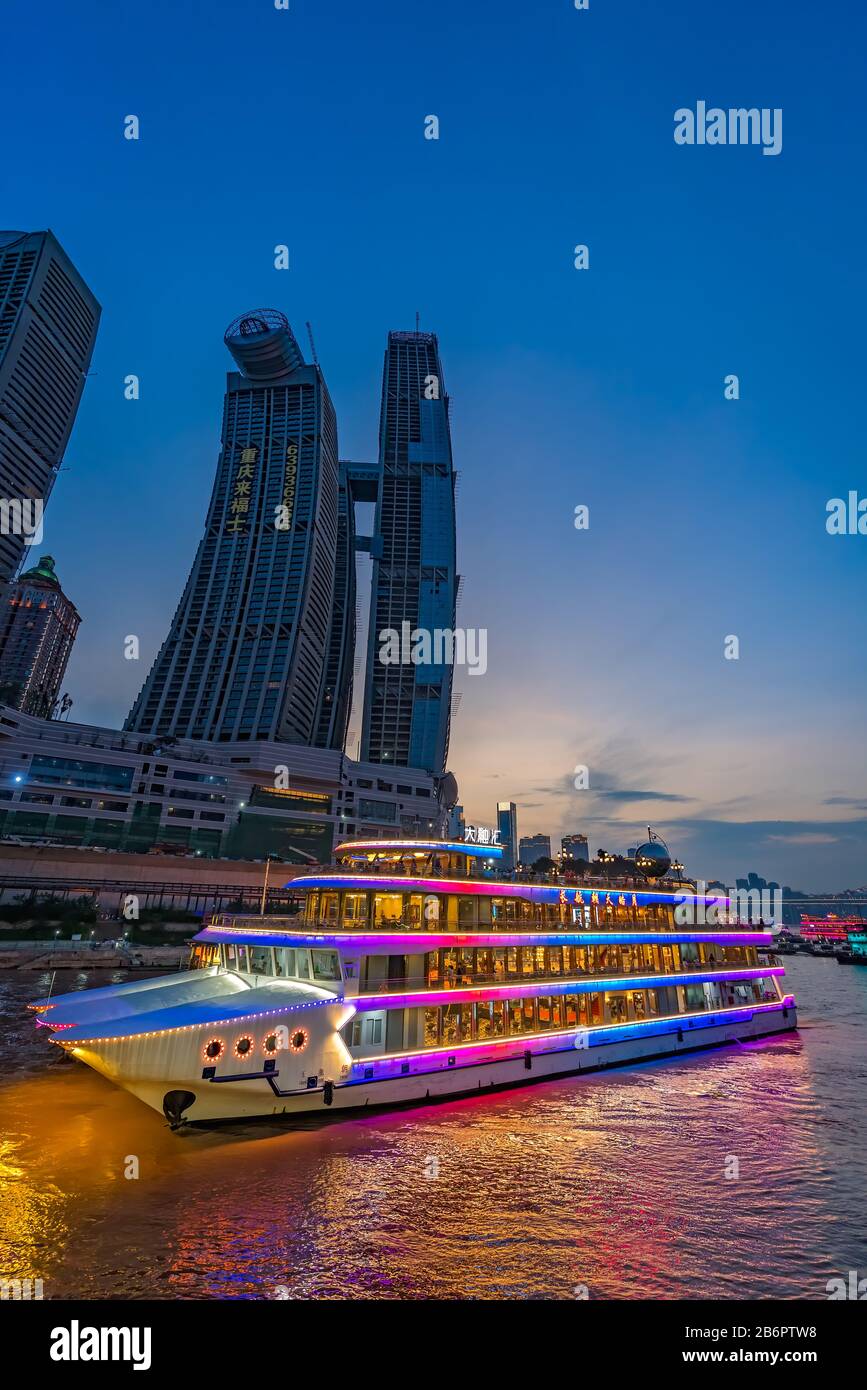 Chongqing, China - August 2019 : Brightly lit passengers ship cruising ...