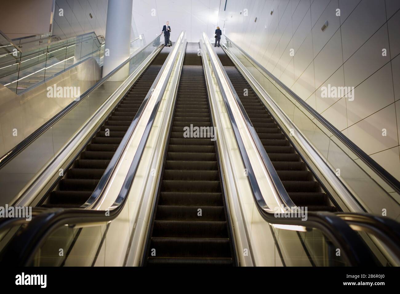 Man riding an escalator up hi-res stock photography and images - Alamy