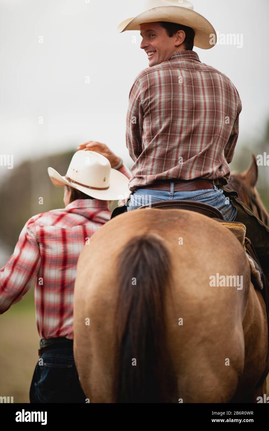 Man horseback riding Stock Photo - Alamy