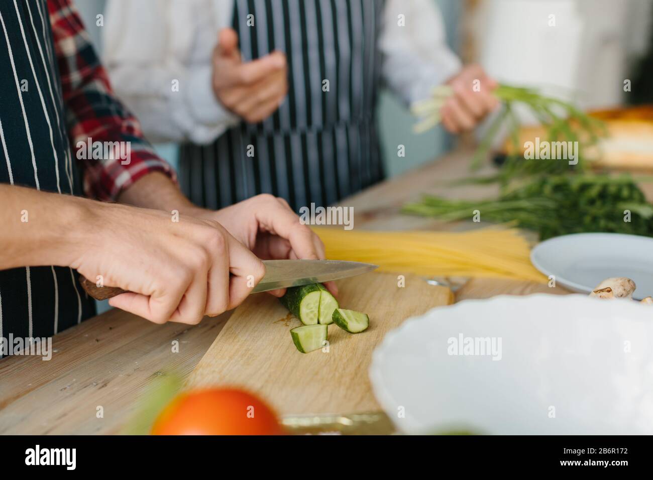 Son with his senior father cooking in the kitchen Stock Photo - Alamy