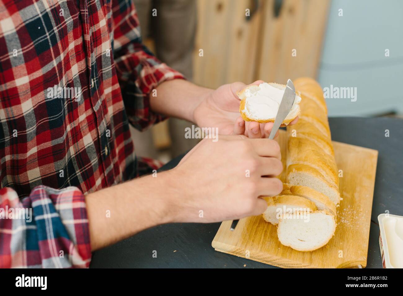 young man making sandwiches Stock Photo - Alamy