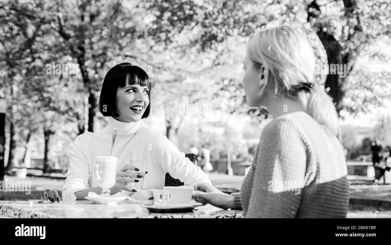 Two girls chatting Black and White Stock Photos & Images - Alamy
