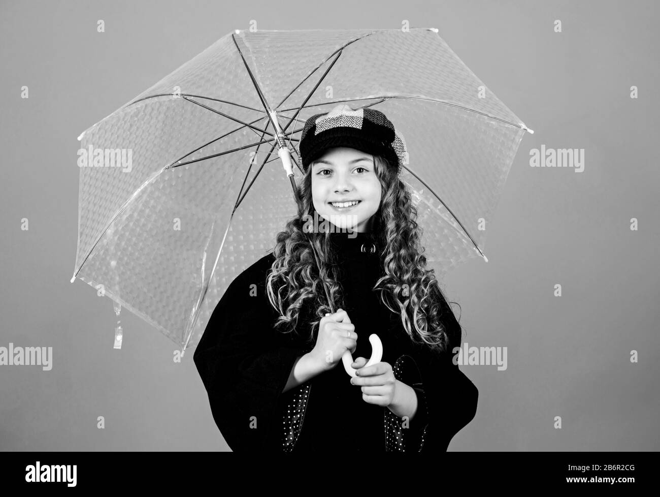 cheerful hipster child in positive mood. rain protection. Rainbow ...