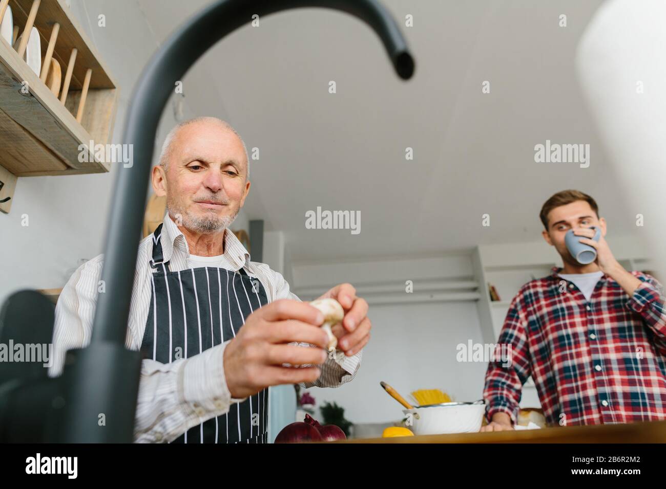 Senior father was washing mushrooms in the kitchen Stock Photo - Alamy
