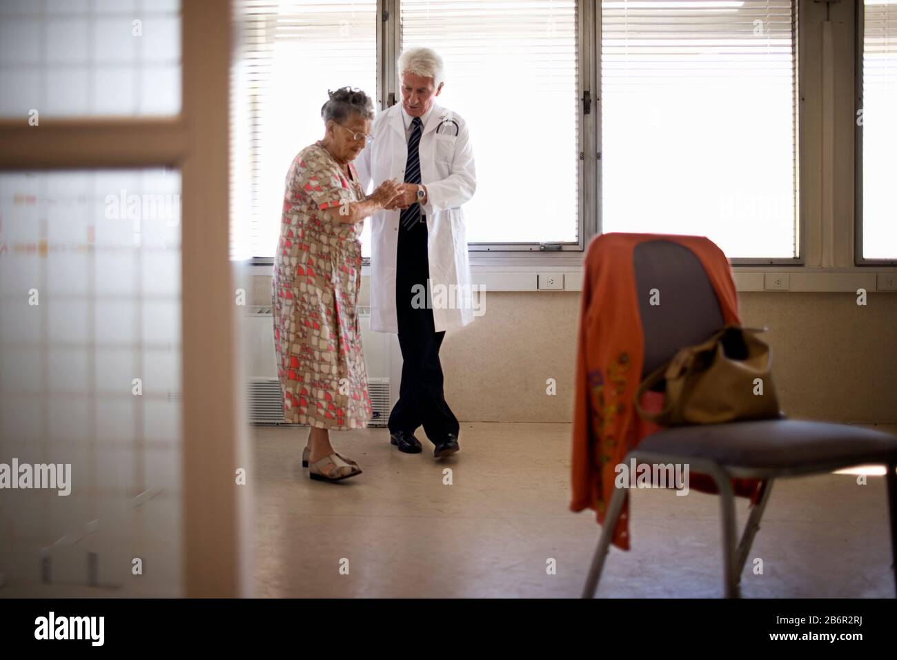 Elderly person being helped to walk hi-res stock photography and images ...