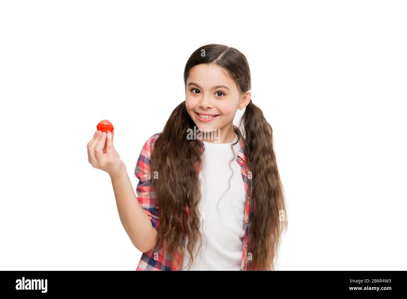 Lip balm for smooth lips. Happy child hold lip balm. Lip makeup ...
