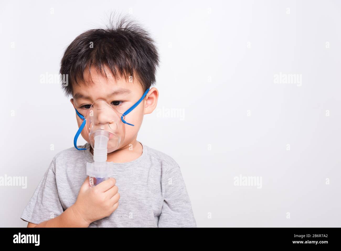Closeup Asian face, Little children boy sick he using steam inhaler ...