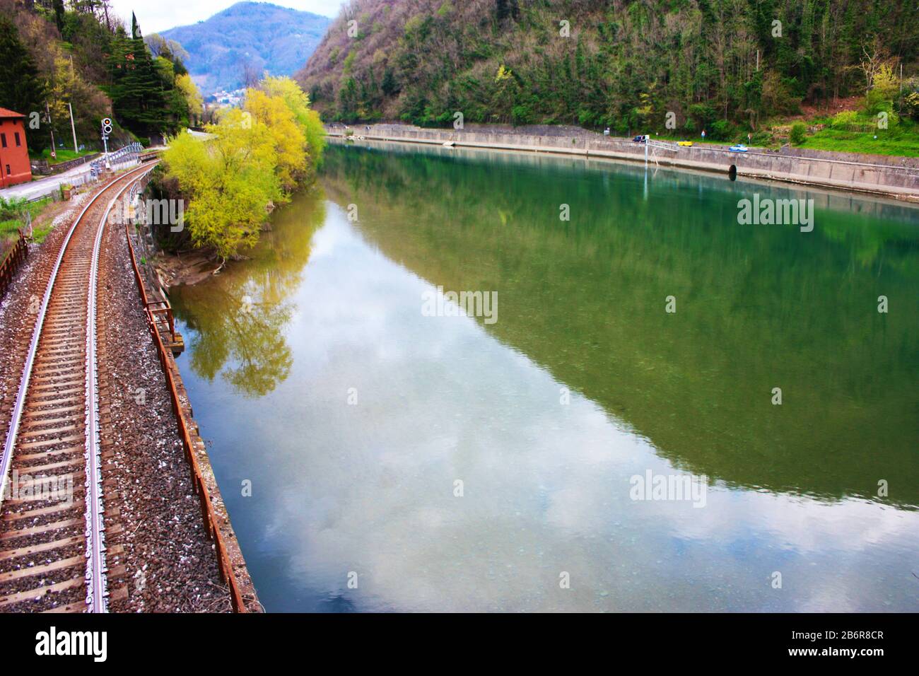 The Tuscan Serchio river in Borgo a Mozzano and the reflection of the ...