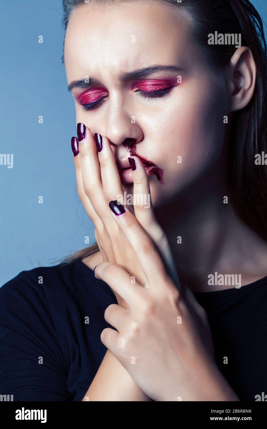 problem depressioned teenager with bleeding nose, real junky close up ...