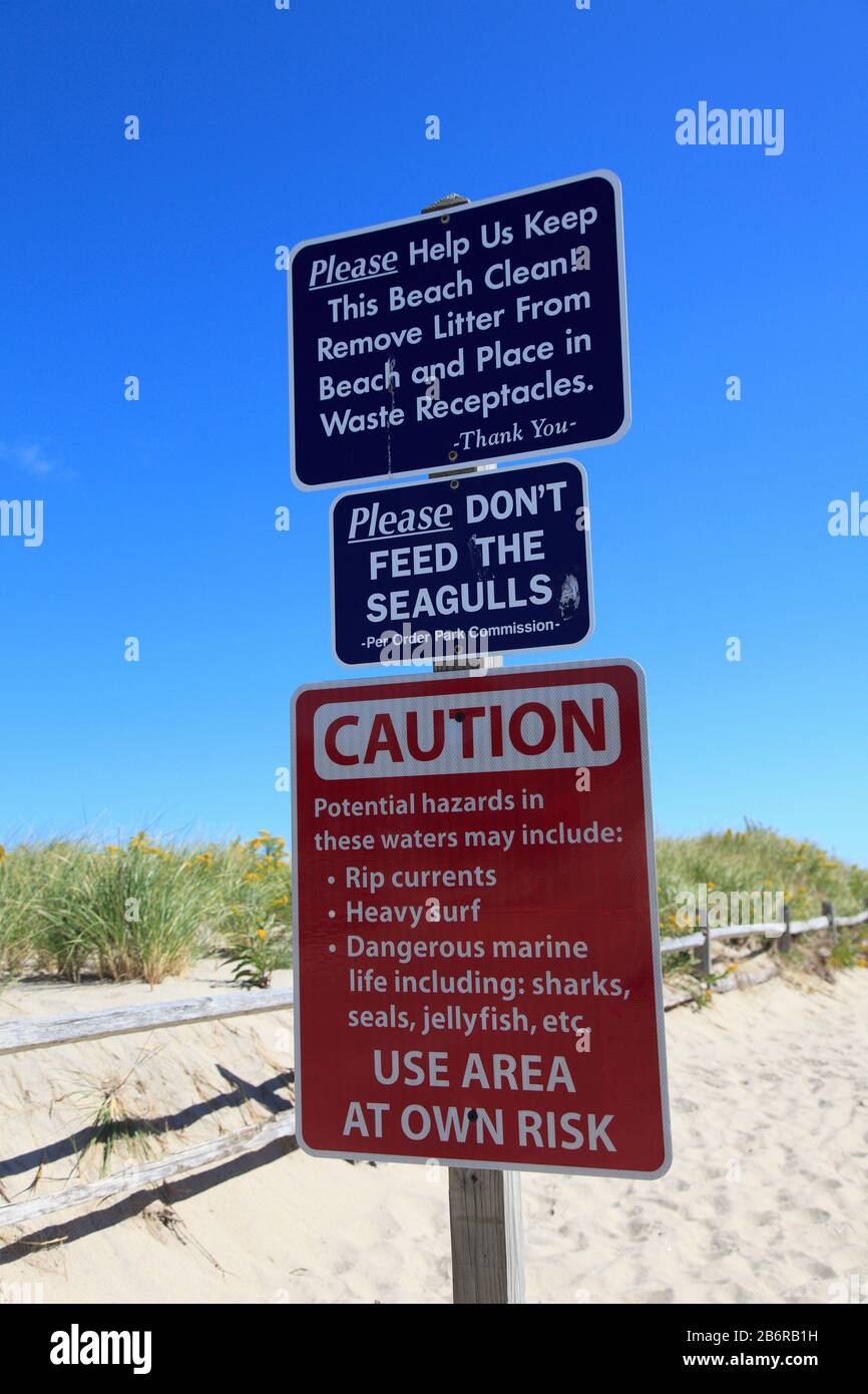 Caution Sign, warning of strong currents, sharks, Nauset Beach, Cape ...