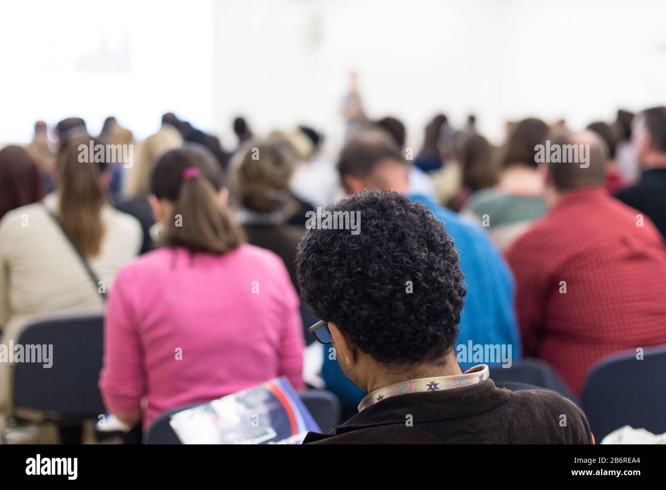 Woman giving presentation on business conference Stock Photo - Alamy