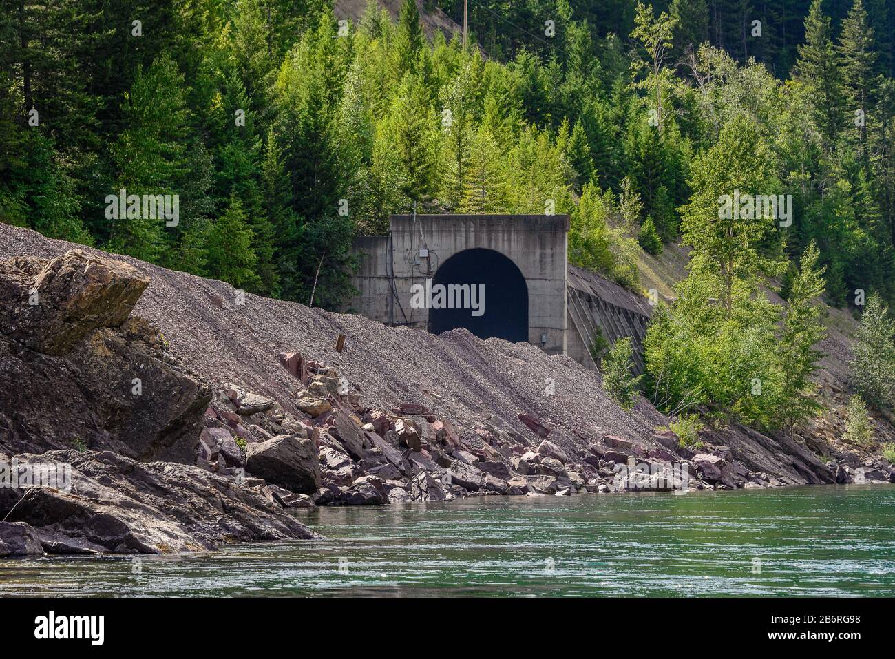 Train tunnel on the river Stock Photo - Alamy