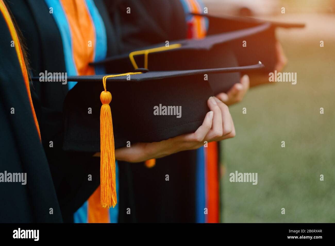 Rearview of the university graduates line up for degree awards in the ...
