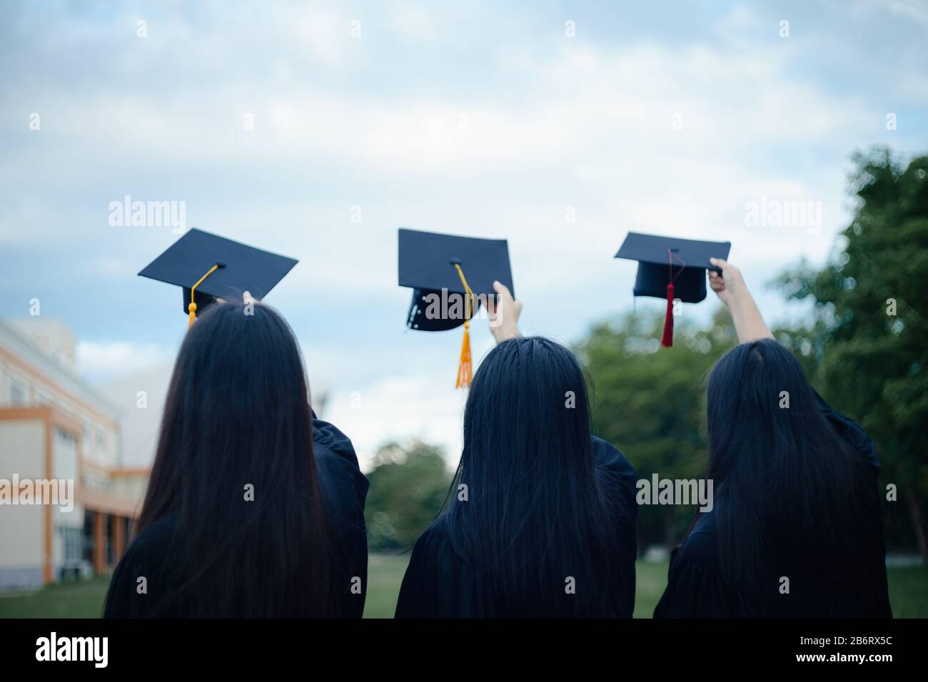 Rearview of the university graduates line up for degree awards in the ...