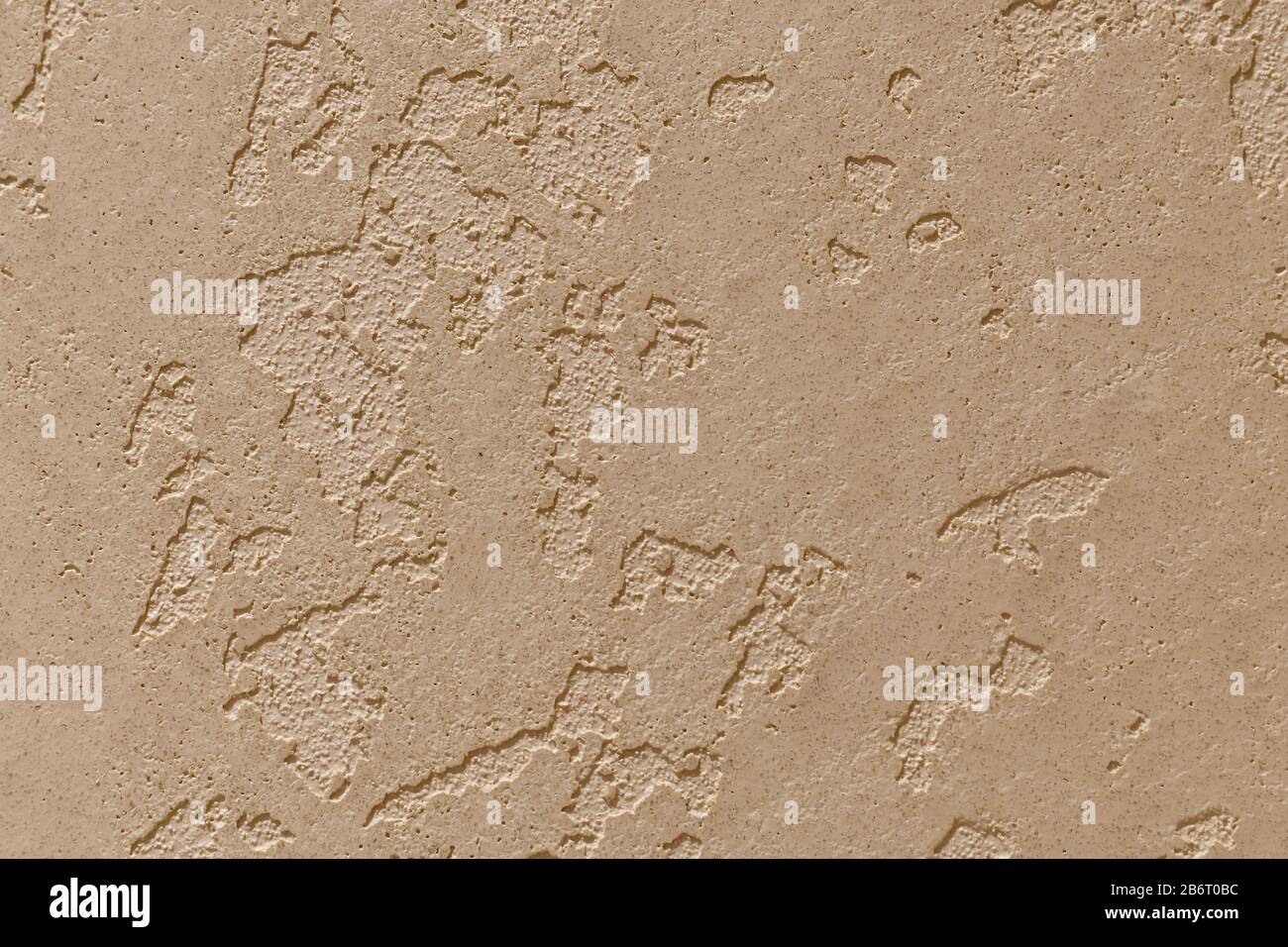 The background is sandy plaster with unfilled mortar islets Stock Photo ...