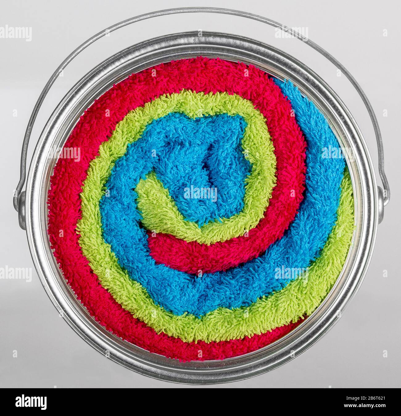 Can of paint mixing colors and textures, bath towels mix Stock Photo ...