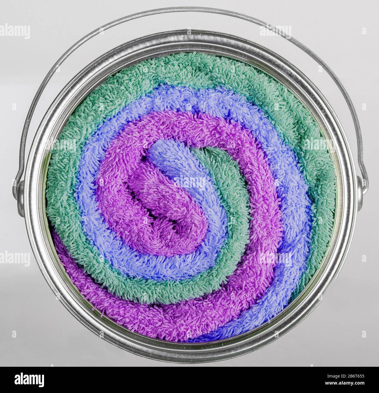 Can of paint mixing colors and textures, bath towels mix Stock Photo ...