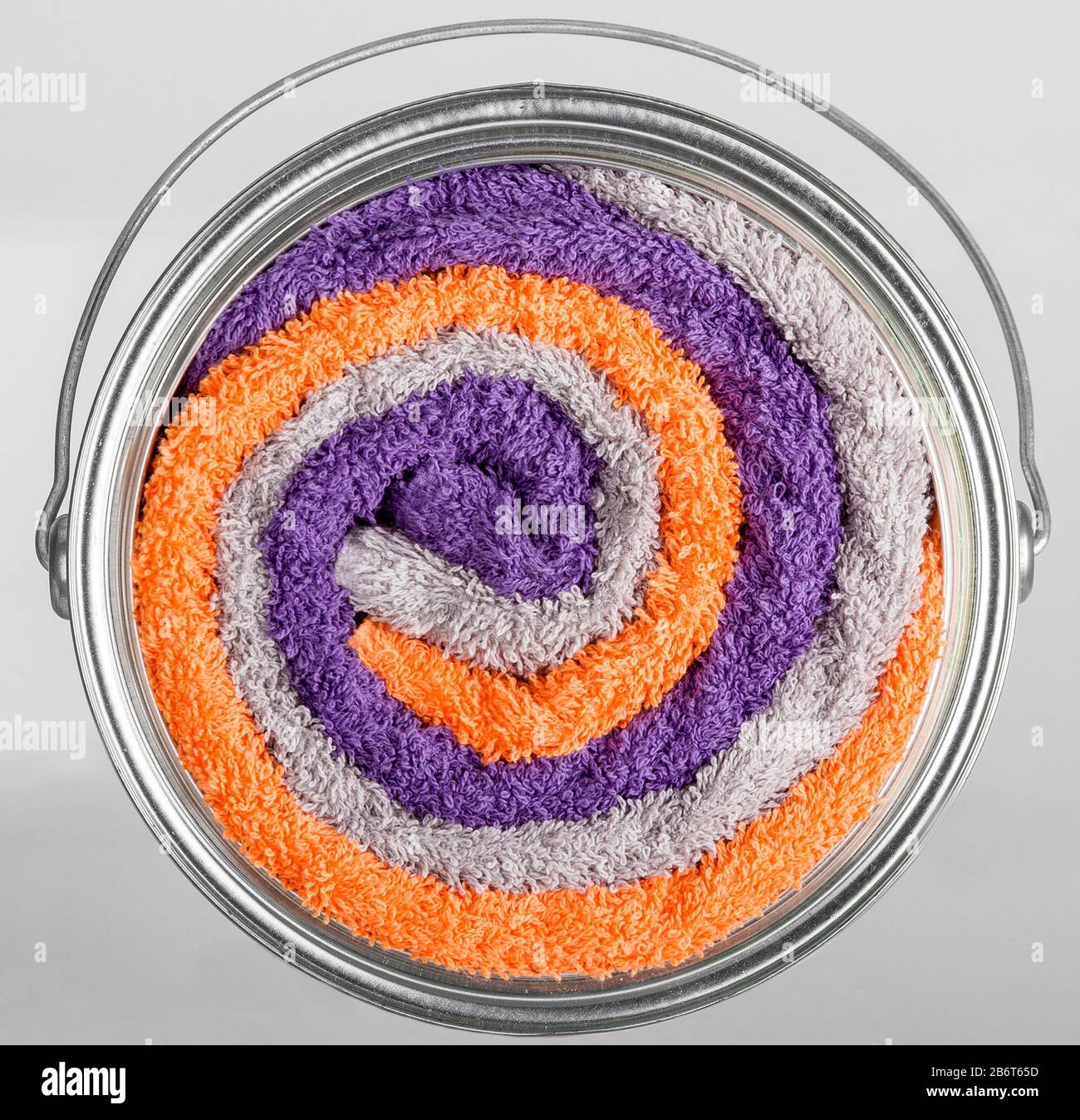 Can of paint mixing colors and textures, bath towels mix Stock Photo ...