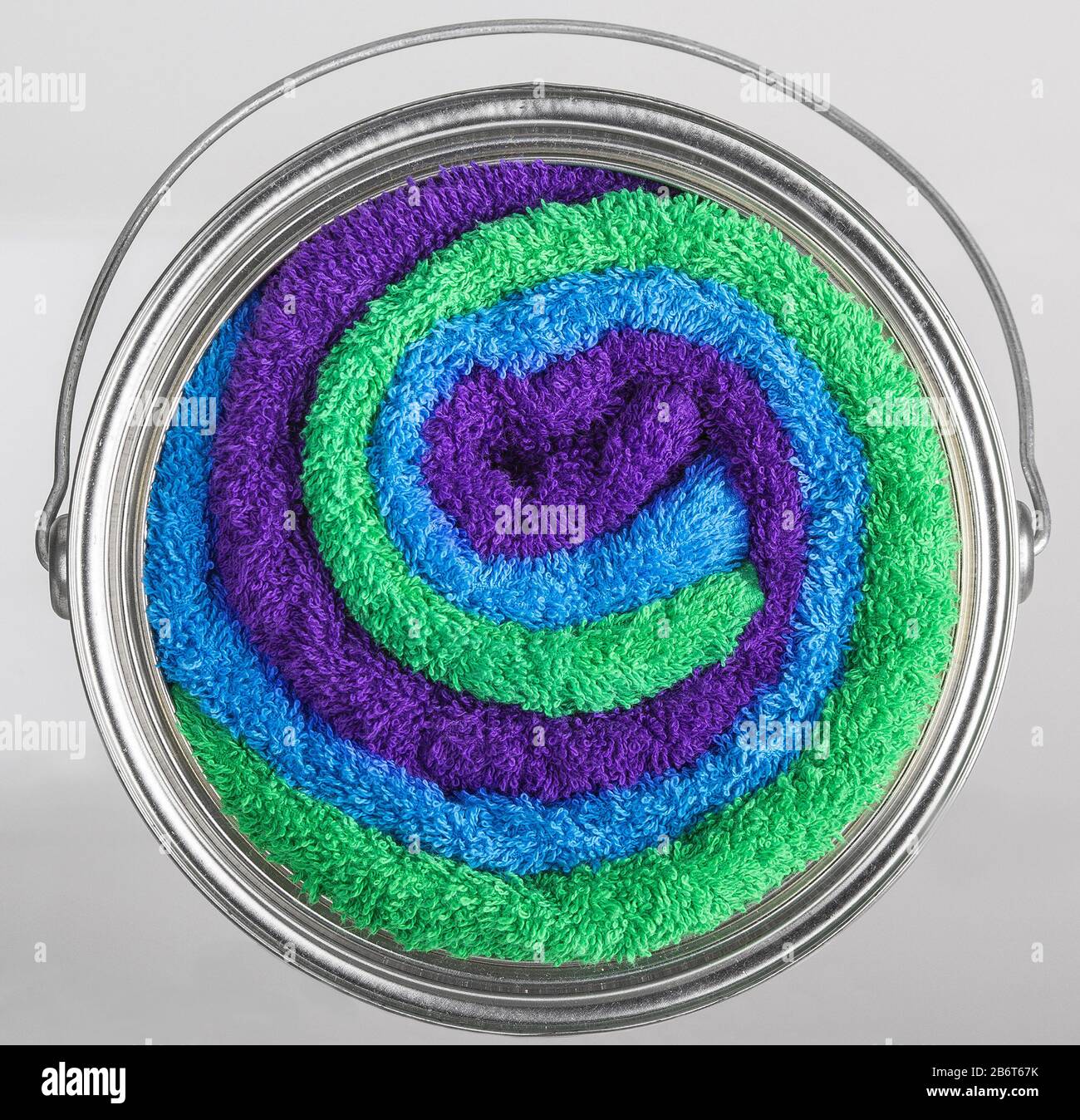 Can of paint mixing colors and textures, bath towels mix Stock Photo ...