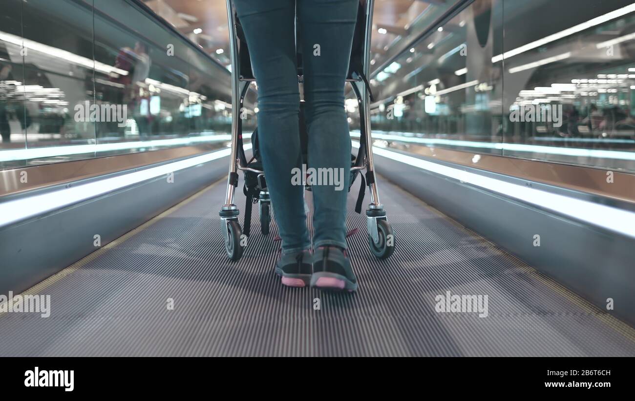 Woman with Luggage Cart at Airport Terminal Lobby. Tracking Shot of ...