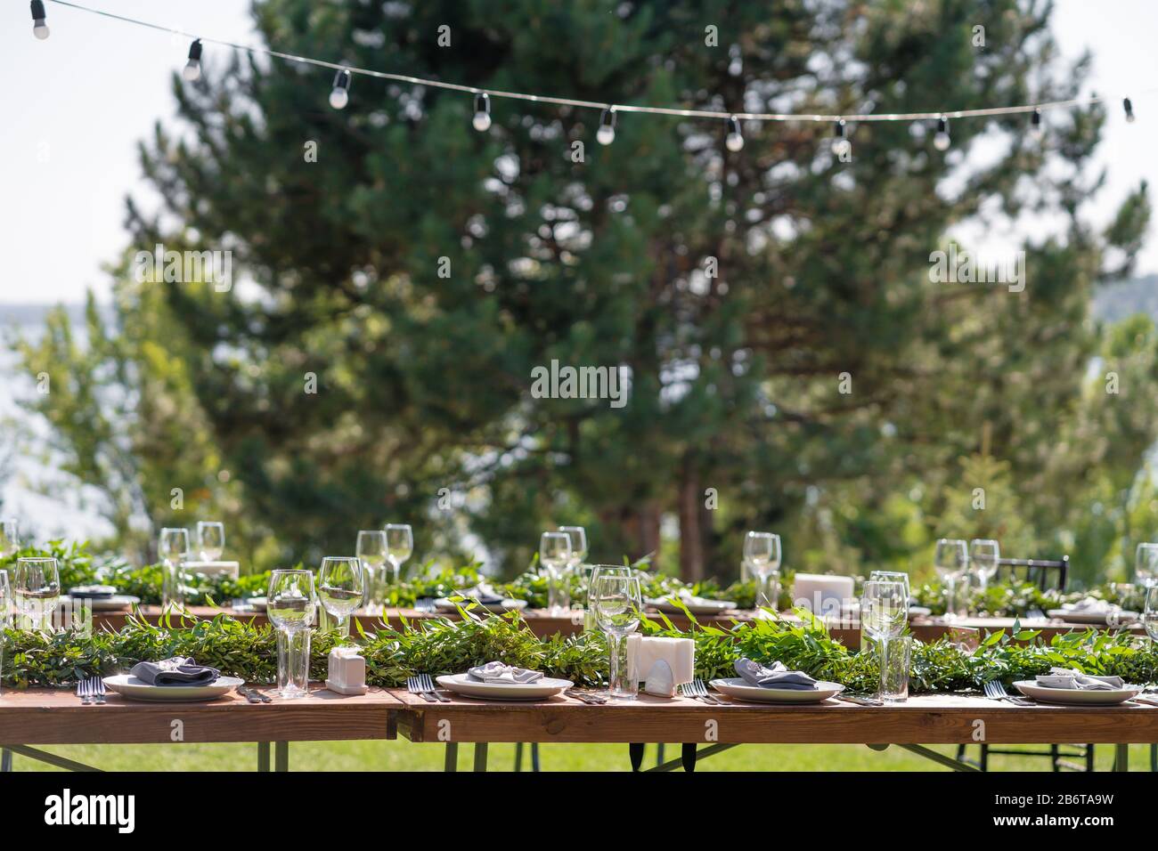 Preparing for an open-air party. Decorated served tables await guests ...