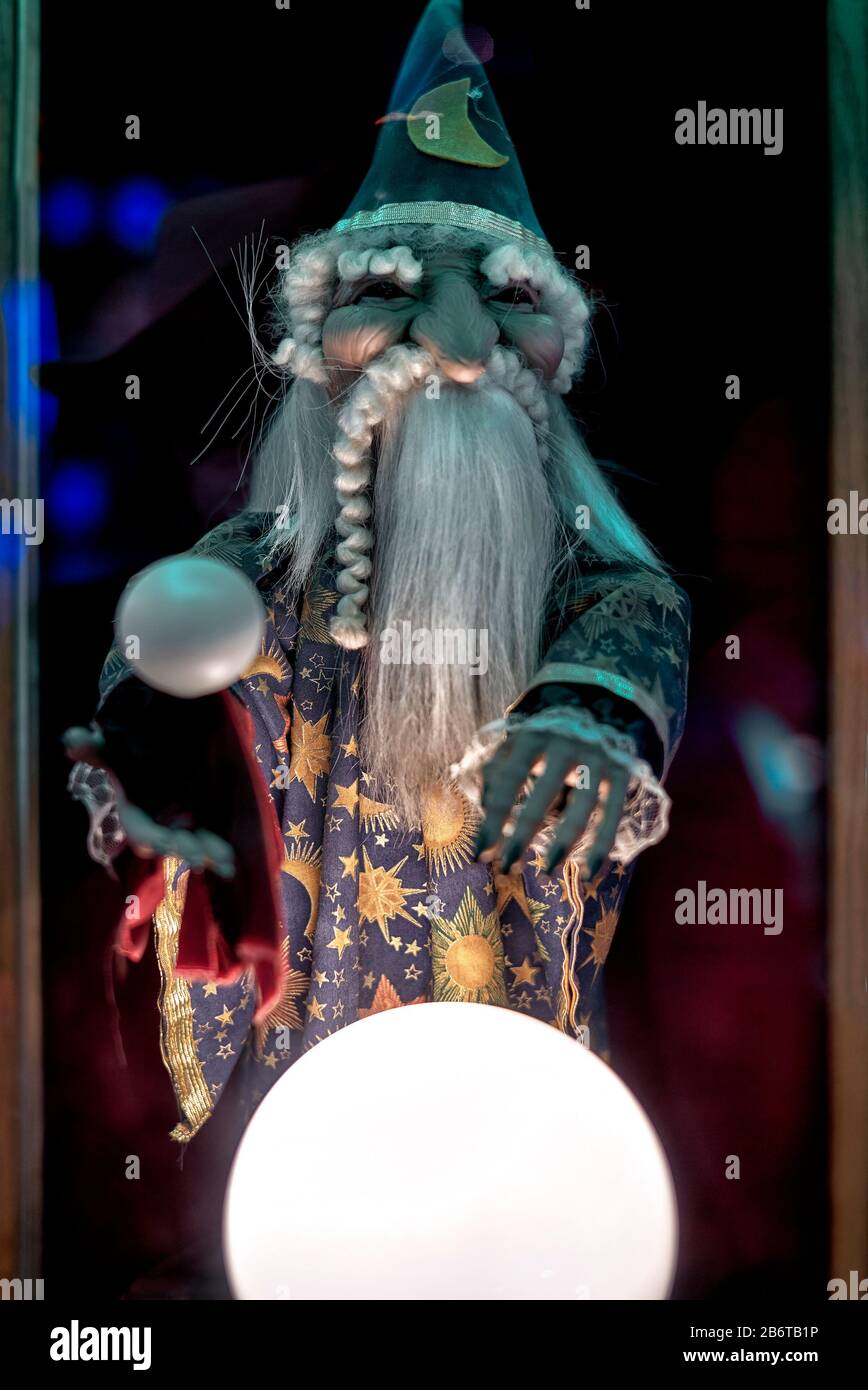 Wizard with a crystal ball and glowing lamp Stock Photo - Alamy