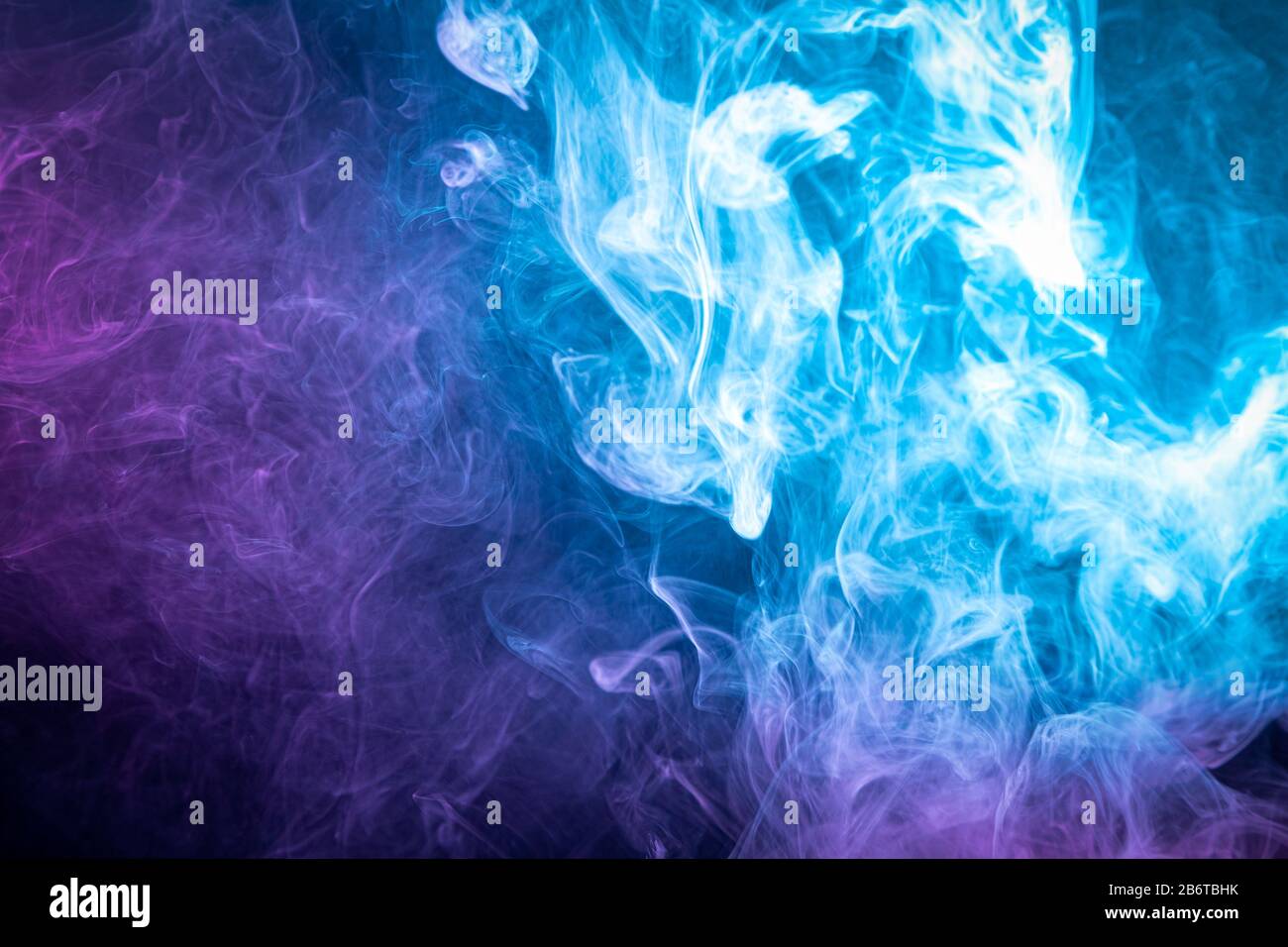 Cloud of pink and blue smoke on a black isolated background. Background ...