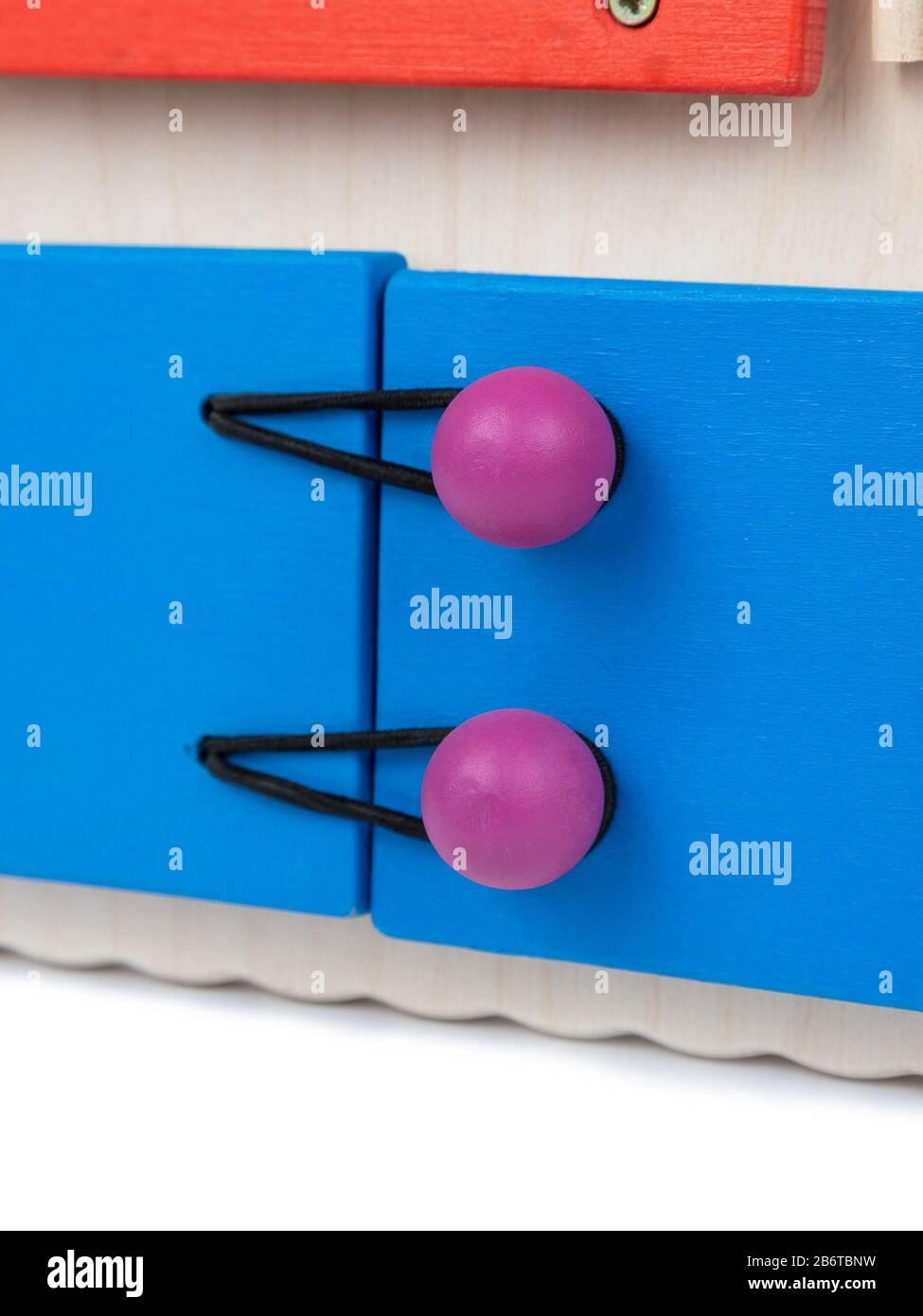 Close-up of a blue padlock on a wooden busy board- educational toy for ...