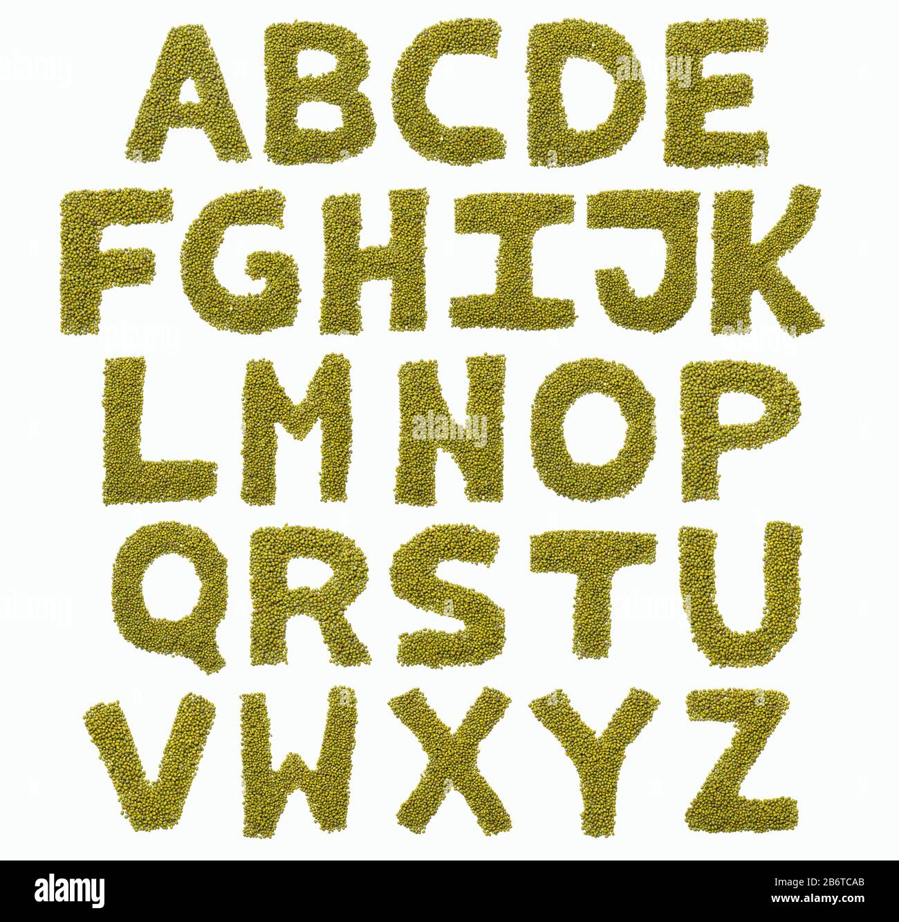English alphabet from green mung bean on a white isolated background ...