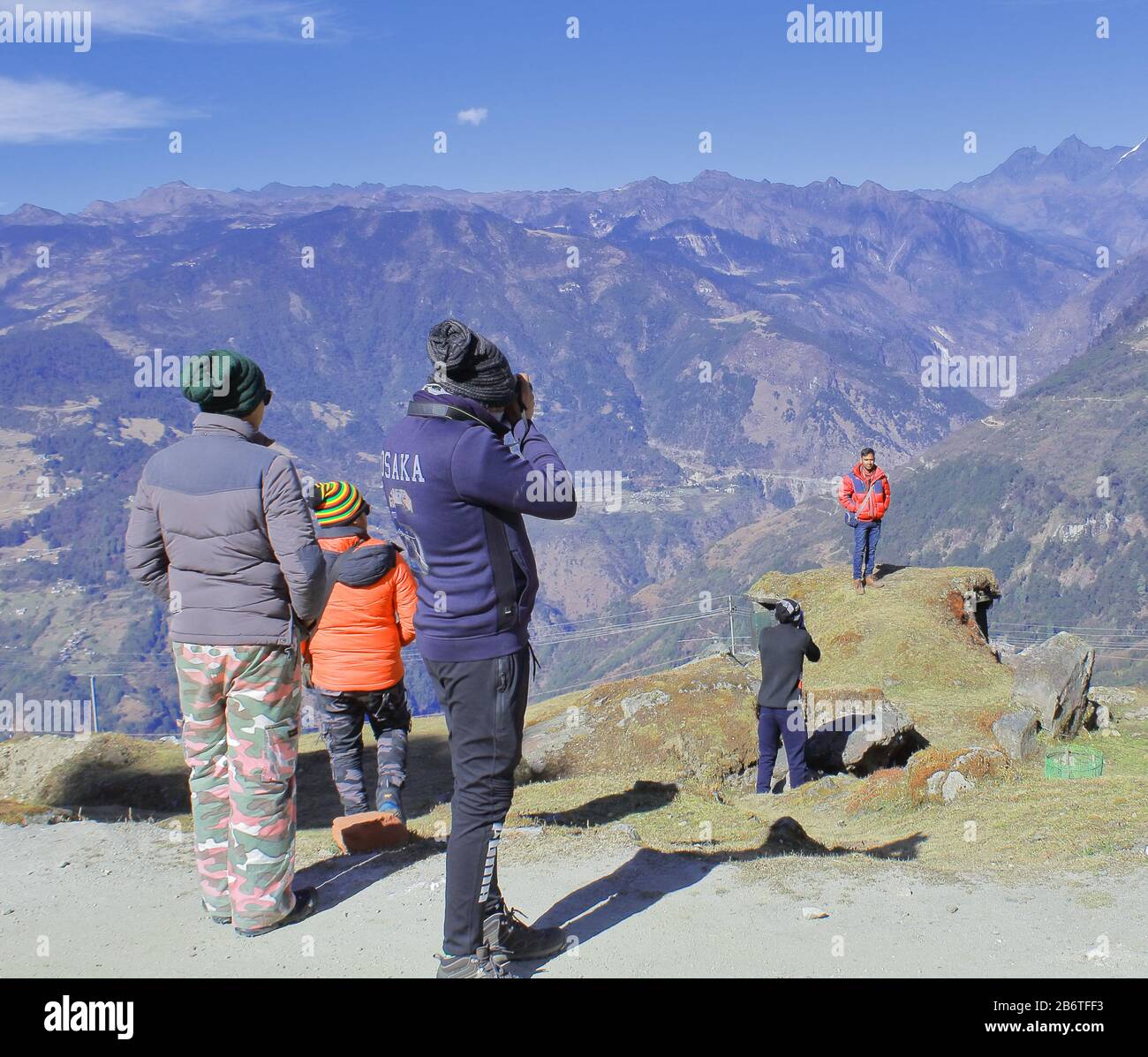 tourists are taking photos of beautiful landscape of snow-capped ...