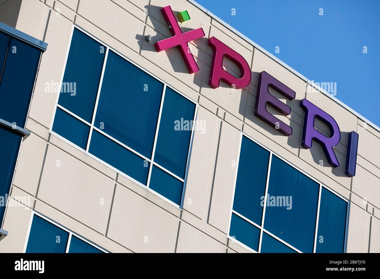 A logo sign outside of a facility occupied by Xperi Corporation in ...