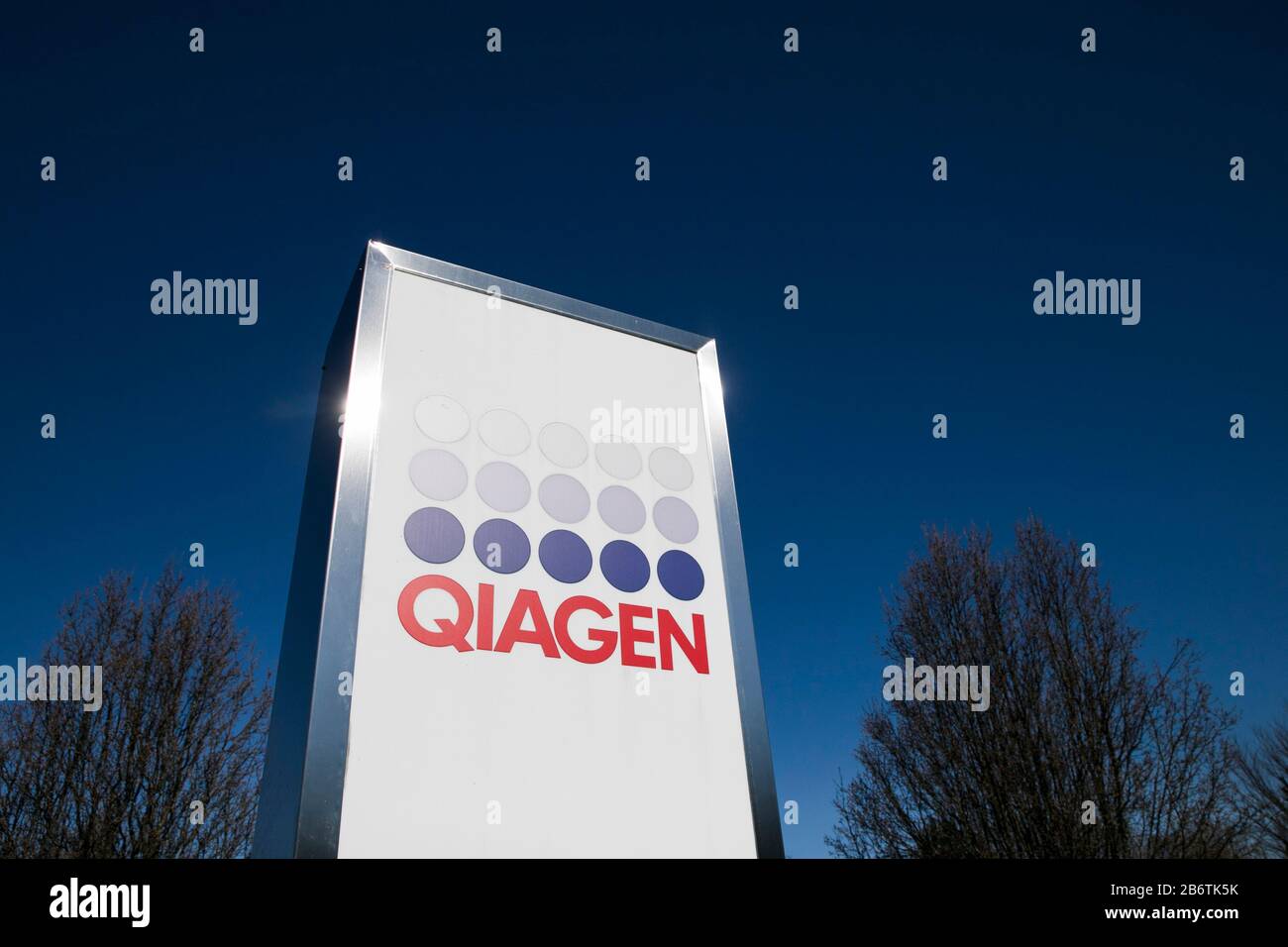 A logo sign outside of a facility occupied by QIAGEN in Germantown ...