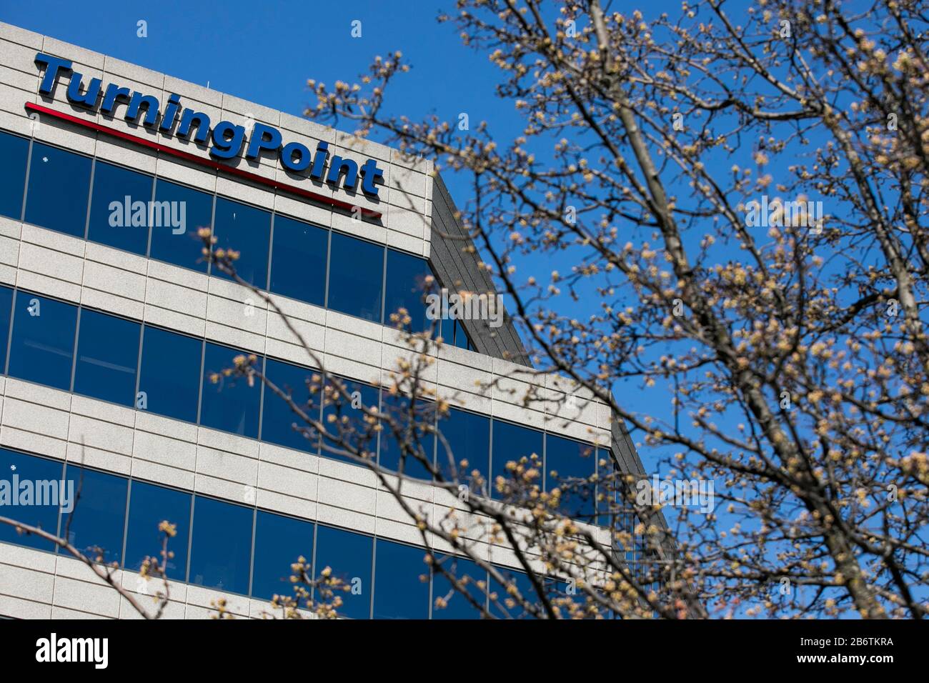 A logo sign outside of the headquarters of TurningPoint Global ...