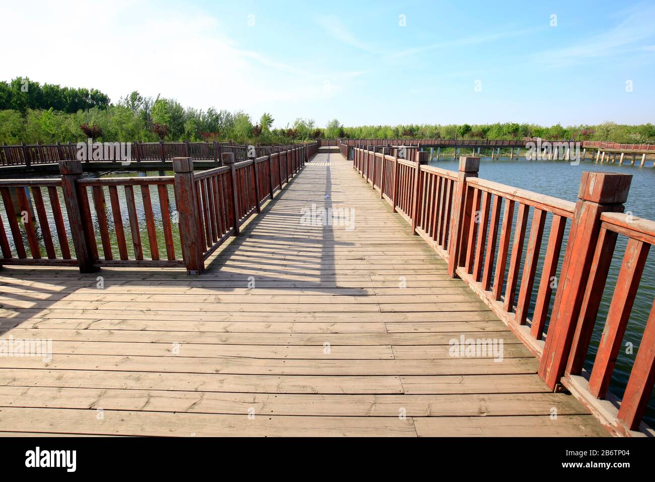 Wooden bridge on the river Stock Photo - Alamy