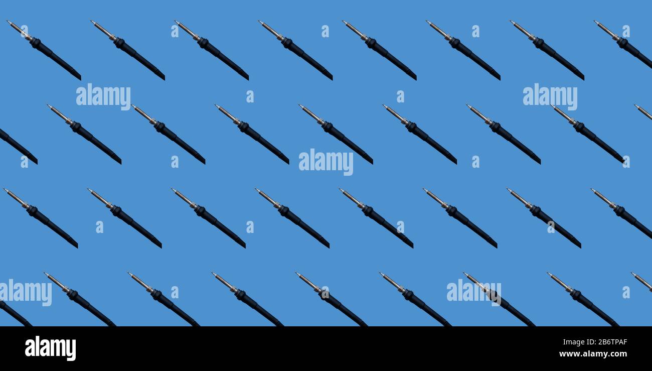 Seamless repeating soldering iron pattern. The black soldering iron has ...