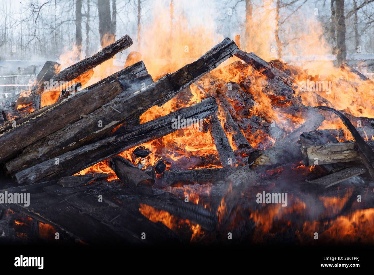 Burning logs of the house became white with temperature. Flames swept ...