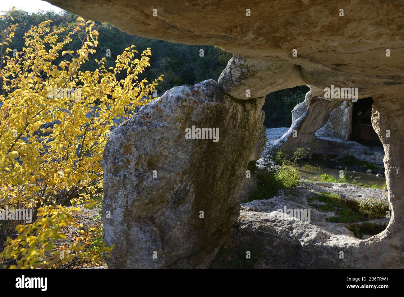 Ancient cave town with yellow trees. Crimea Stock Photo - Alamy
