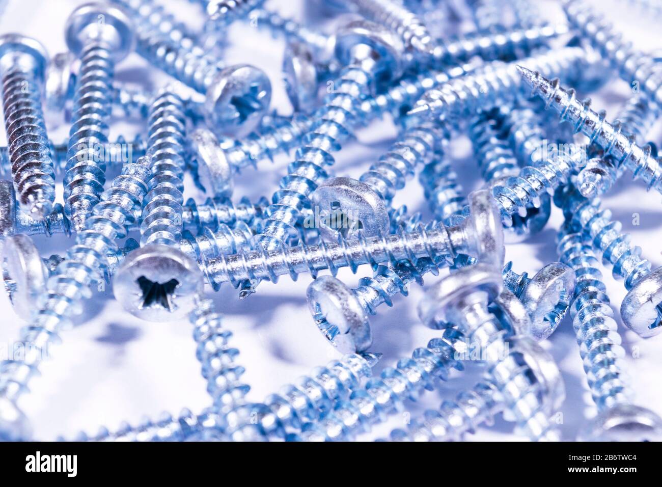 Self tapping metal screw background. Self-tapping screws. Background of ...