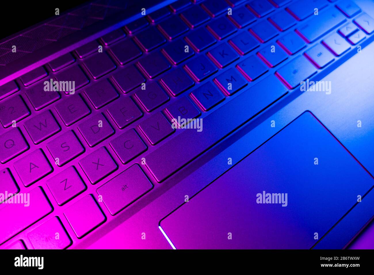 Close up view of a modern laptop computer keyboard keys. Soft lightning ...