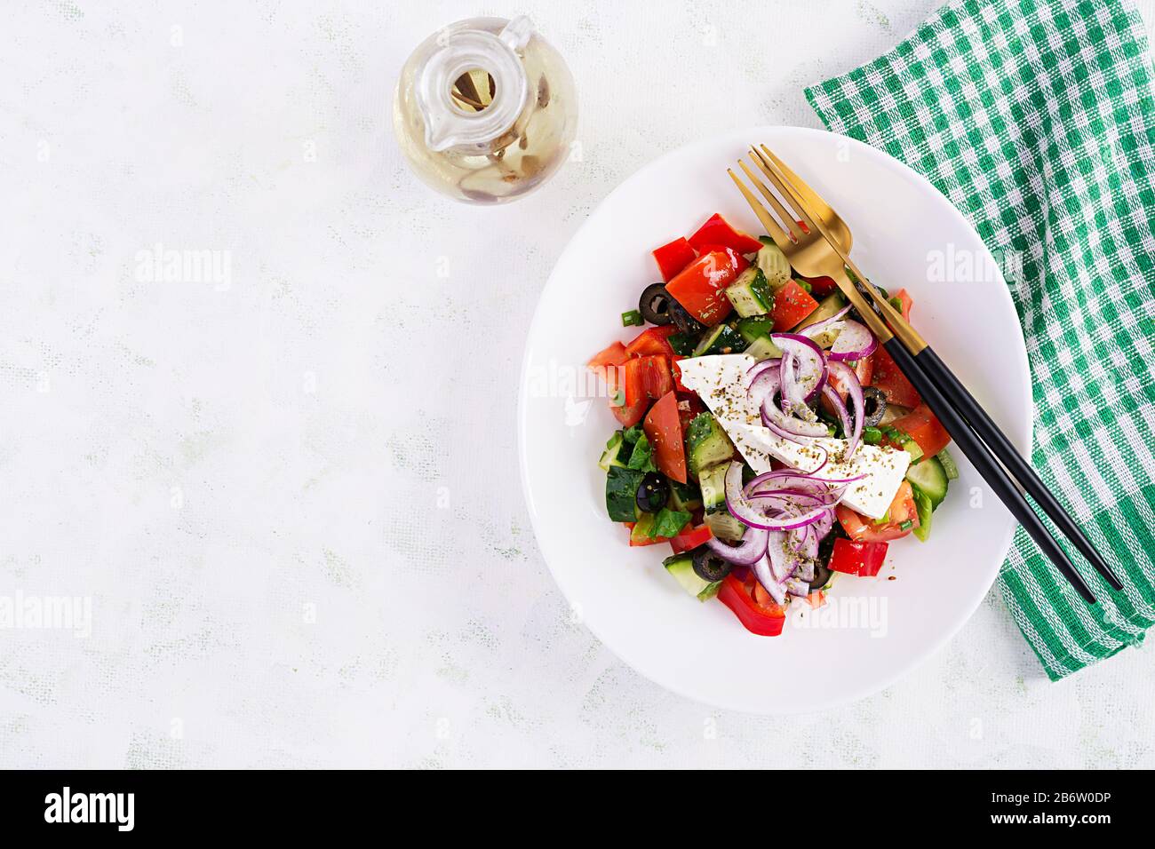 Trendy salad. Greek salad with fresh vegetables, feta cheese and black ...