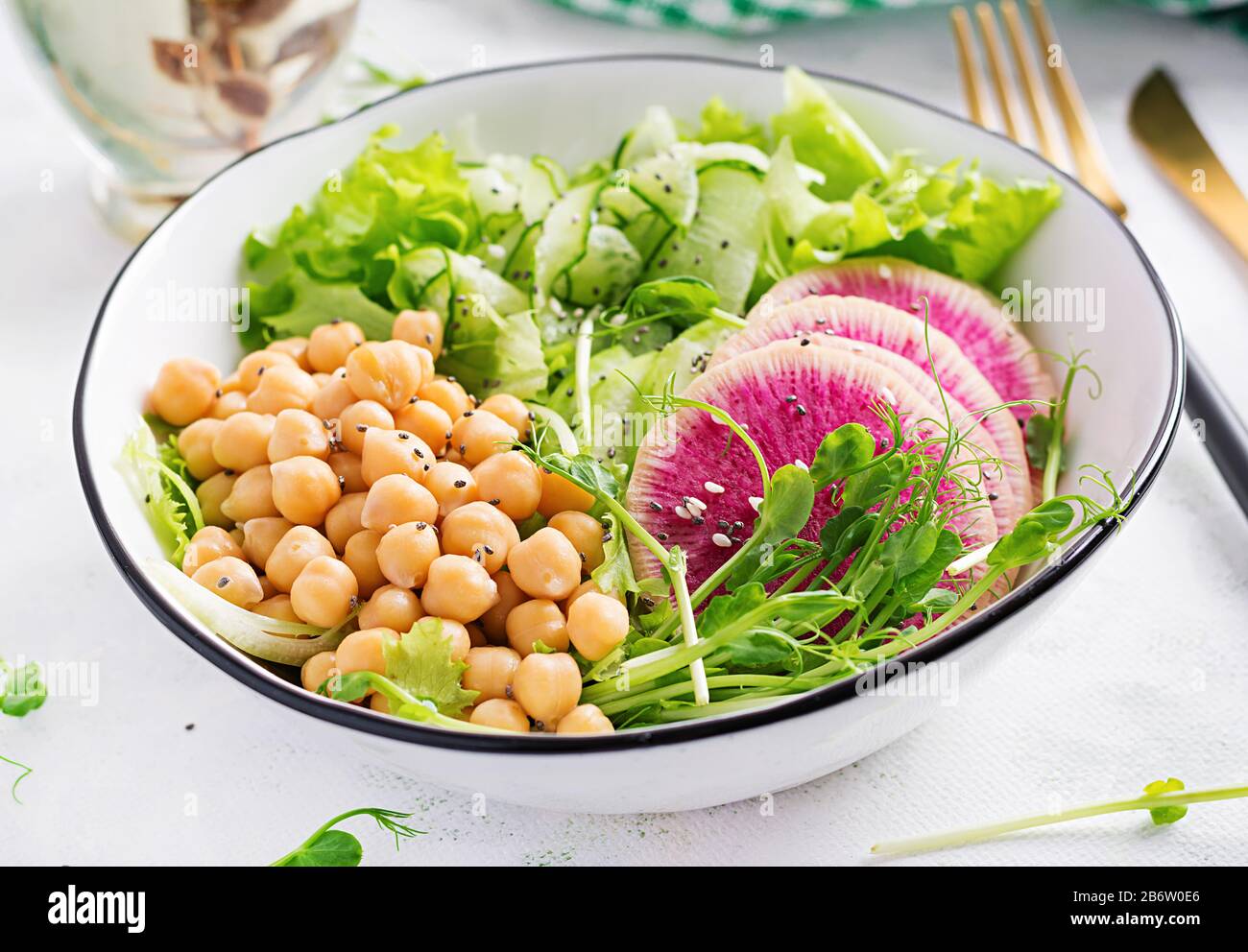 Trendy salad. Vegan Buddha bowl with chickpeas, watermelon radish ...