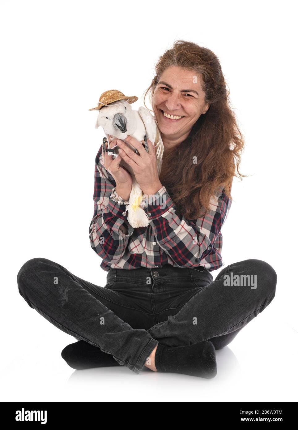cockatoo and woman in front of white background Stock Photo - Alamy