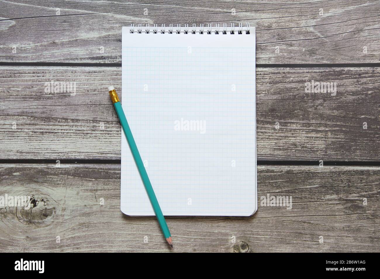 Notepad with a blank white sheet in a checker paper with simple ...