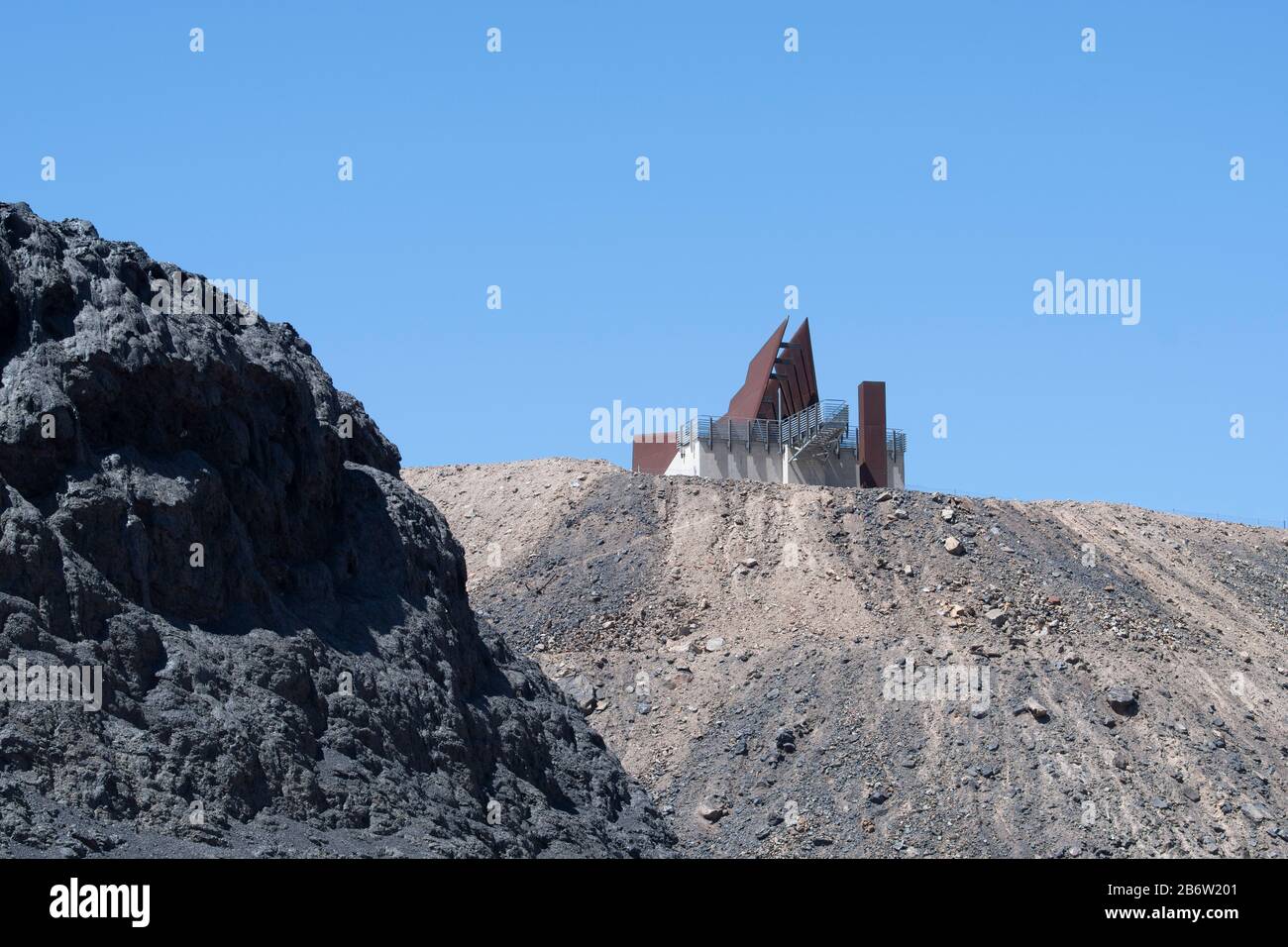 View of the Line of Lode Miners' Memorial on top of mullock heaps ...