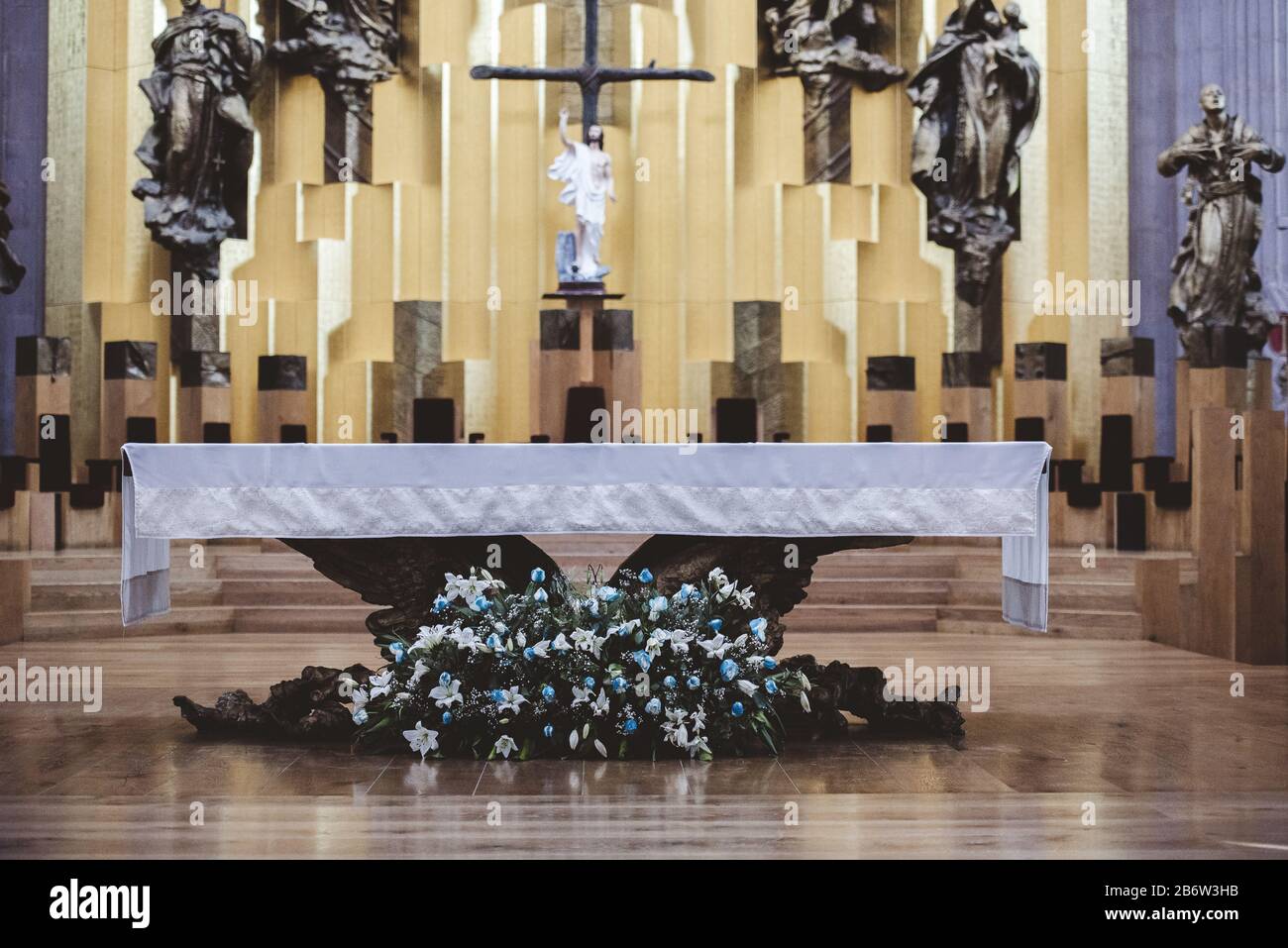 Altar of a Catholic Church surrounded by lights and statues in Mexico ...
